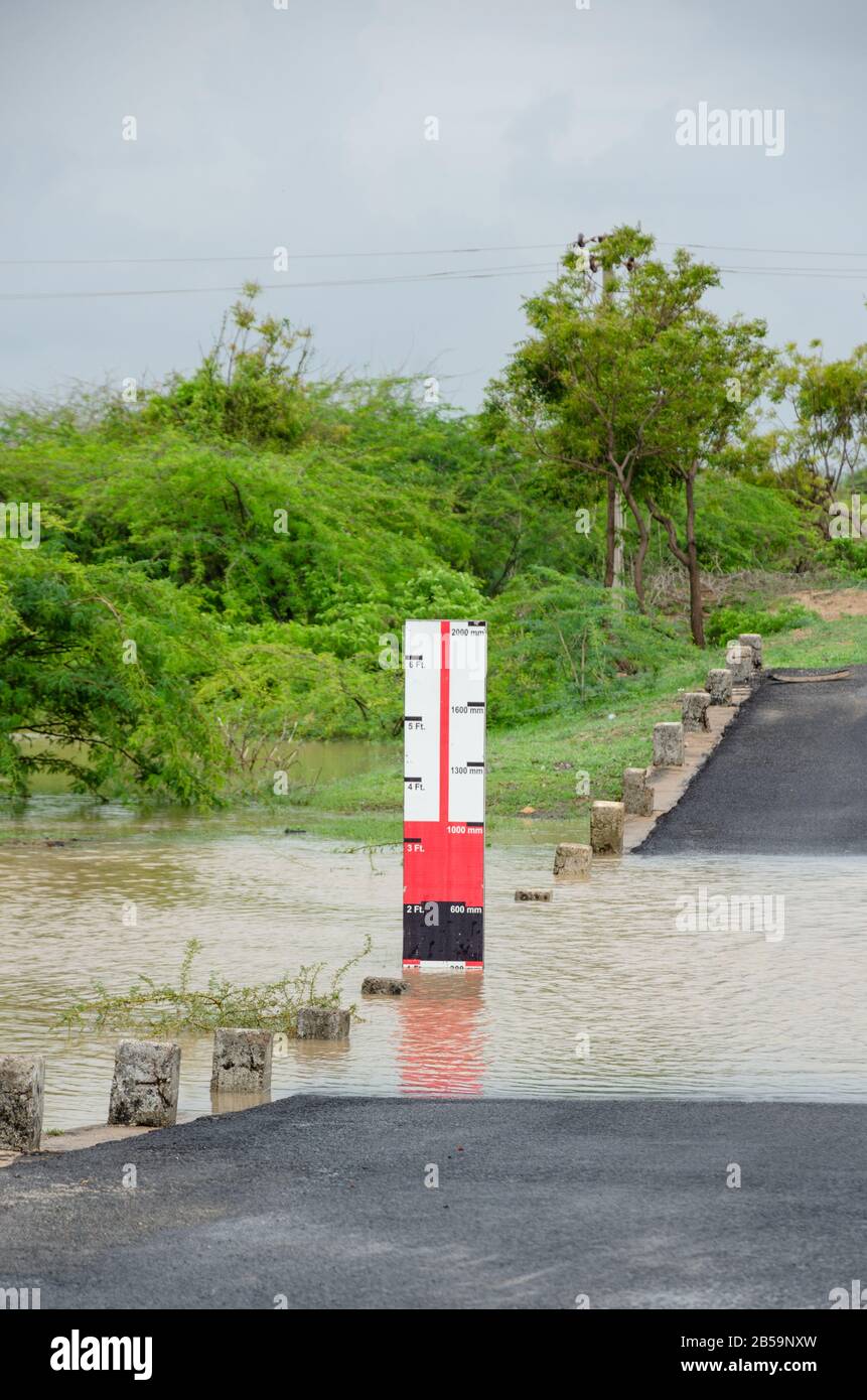 Roadside water level indictor that marks the depth of flood water ...