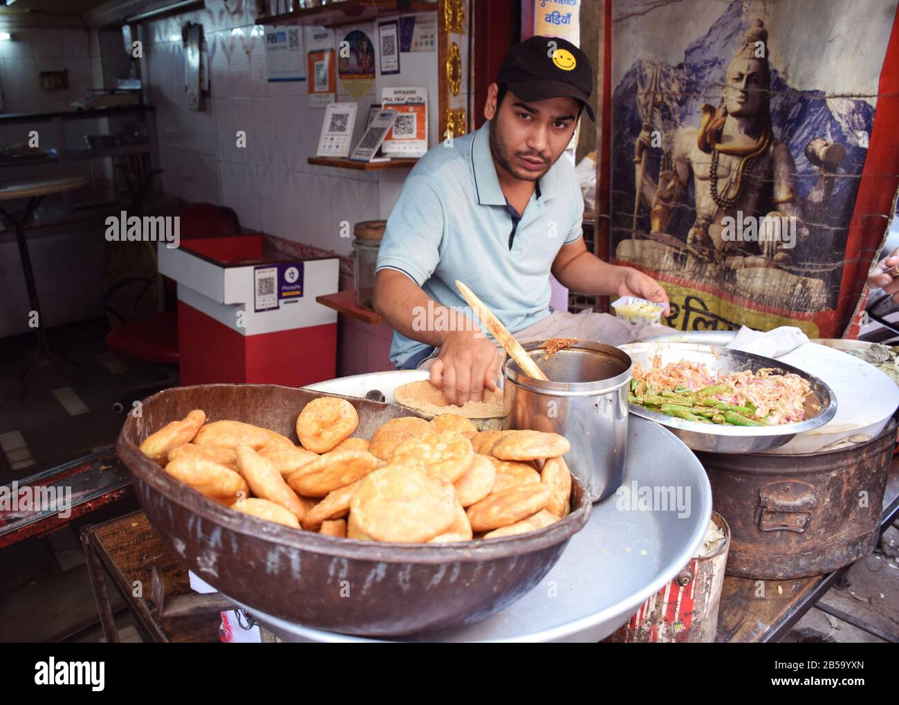 Street Food of Delhi, Paharganj in which a kachori owner is sitting in ...