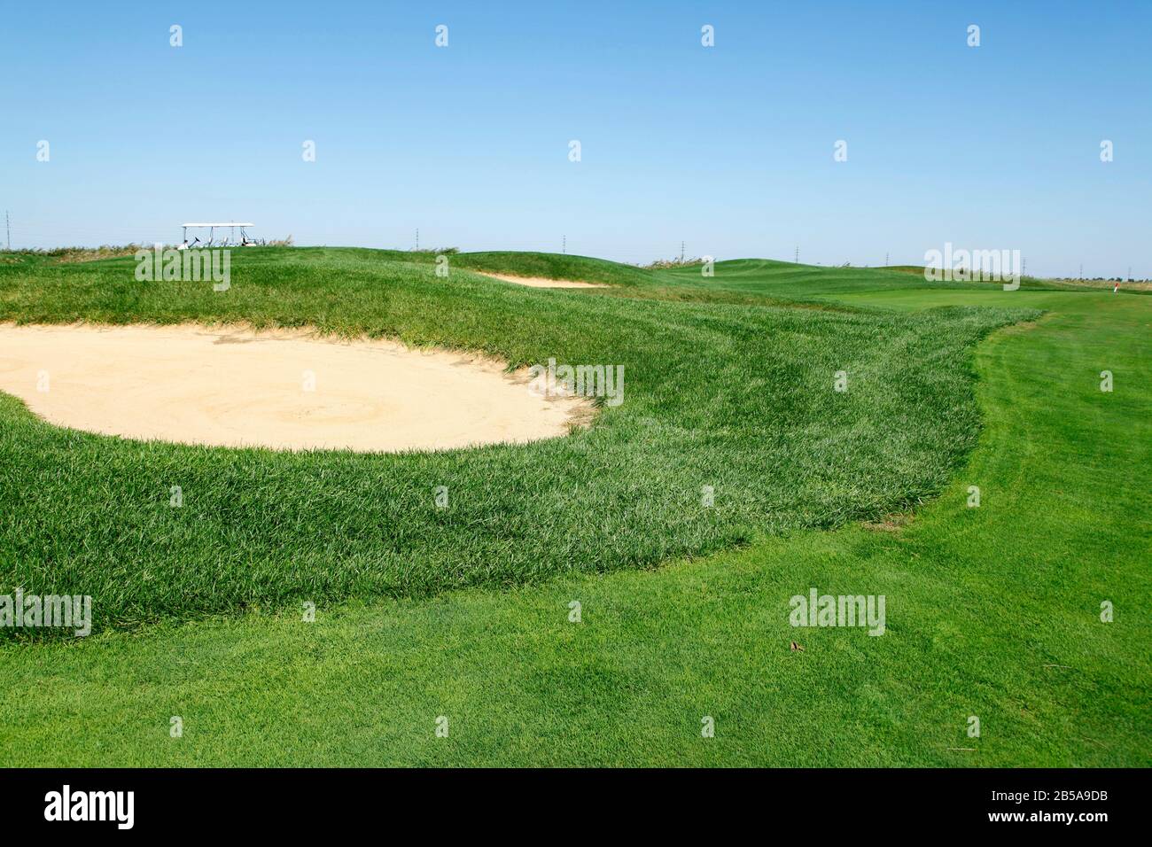Sand bunker on the golf course Stock Photo - Alamy