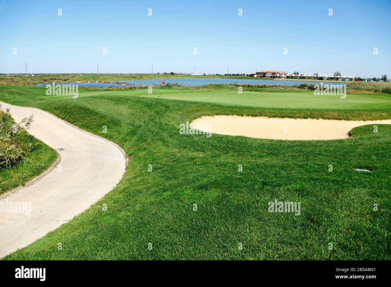 Sand bunker on the golf course Stock Photo - Alamy