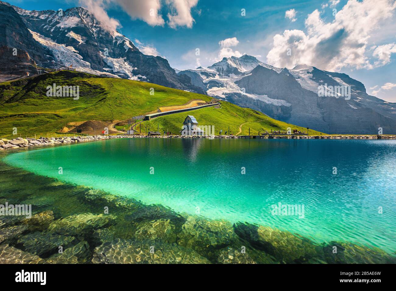 Stunning mountain lake near Kleine Scheidegg. Snowy mountains with ... Stunning mountain lake near Kleine Scheidegg. Snowy mountains with ...
