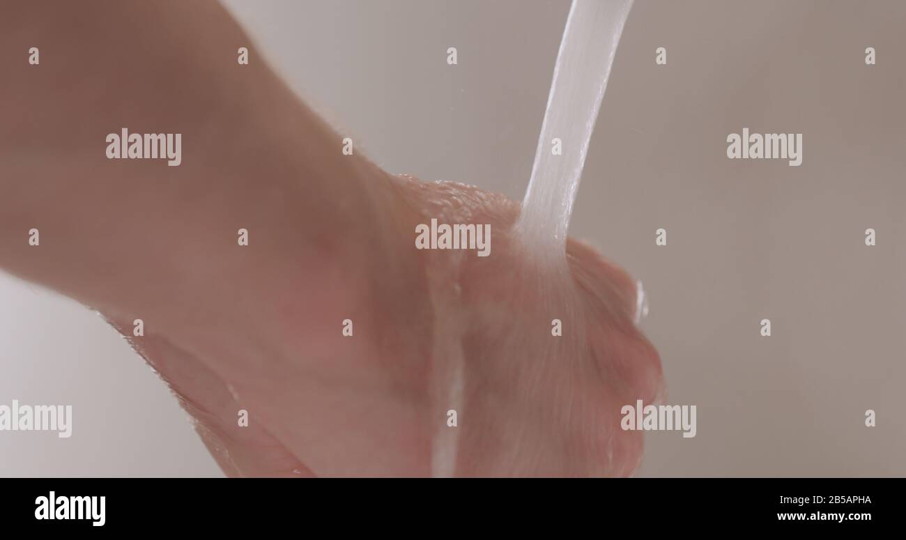 man washing hands under faucet closeup, wide photo Stock Photo - Alamy