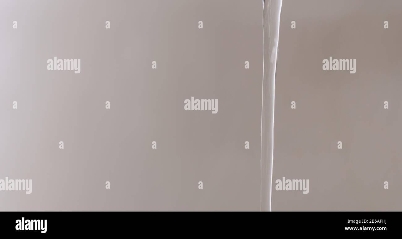 water flow from faucet closeup, wide photo Stock Photo - Alamy
