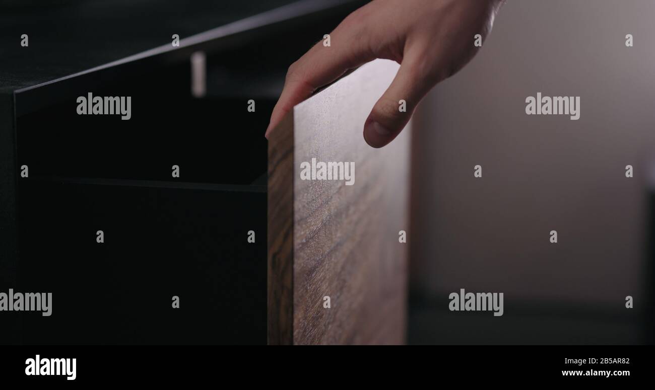 man hand open tv stand drawer closeup, wide photo Stock Photo - Alamy