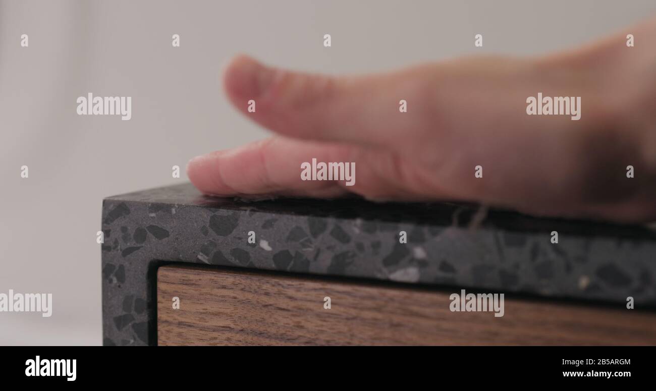 man hand dust off bathroom cabinet, wide photo Stock Photo - Alamy