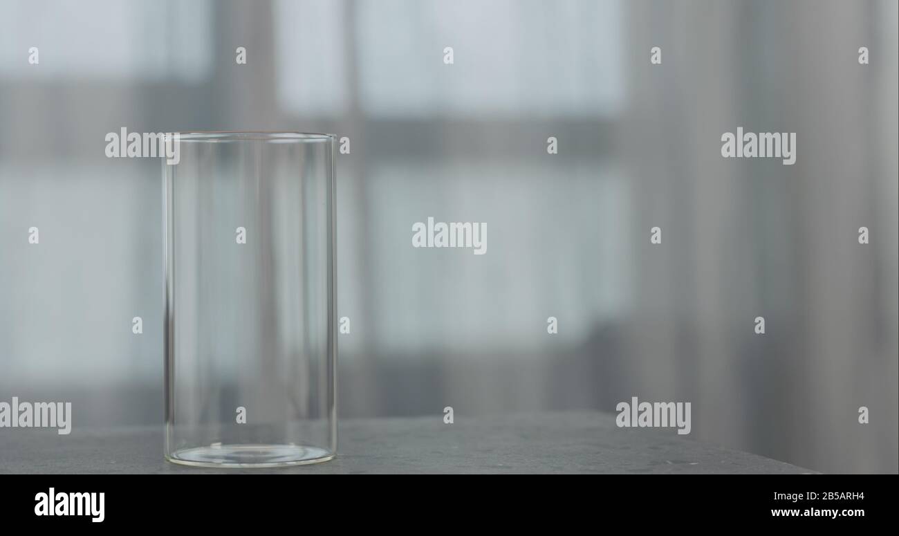 empty glass on concrete surface, wide photo Stock Photo - Alamy