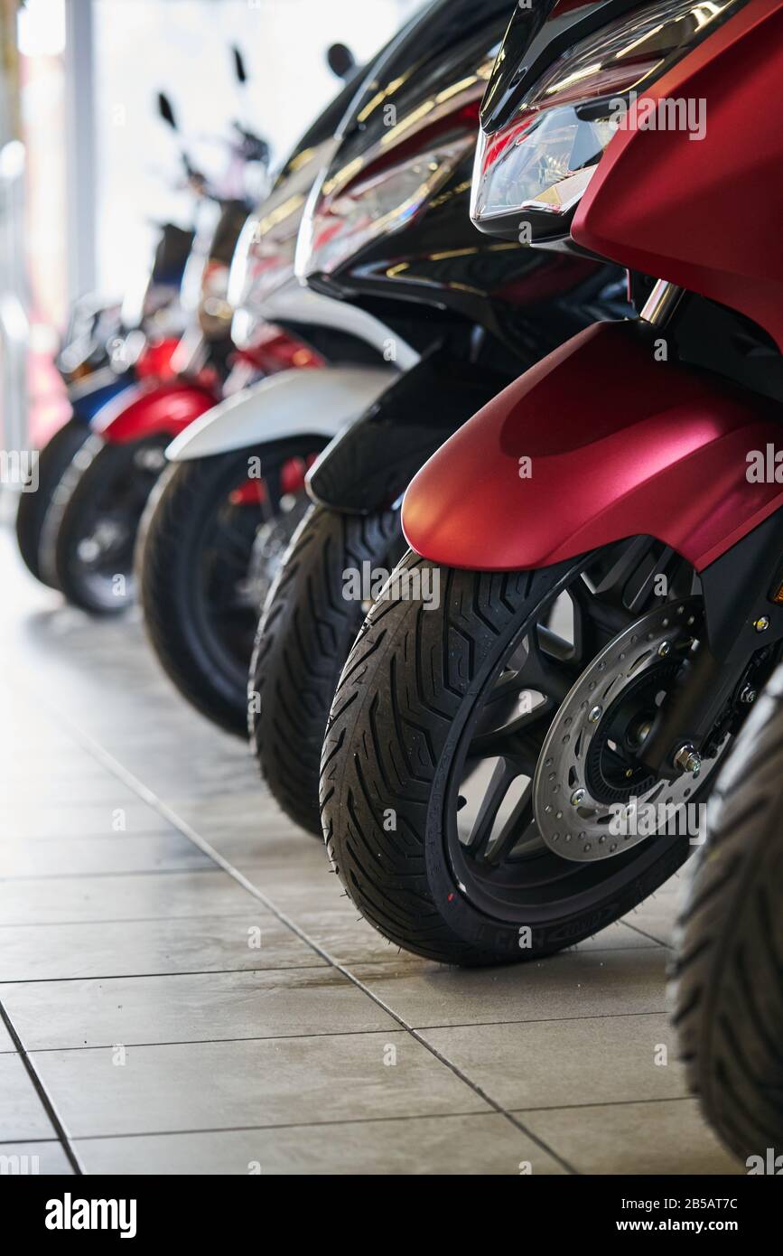 The front tire of a parked custom motorcycle Stock Photo - Alamy