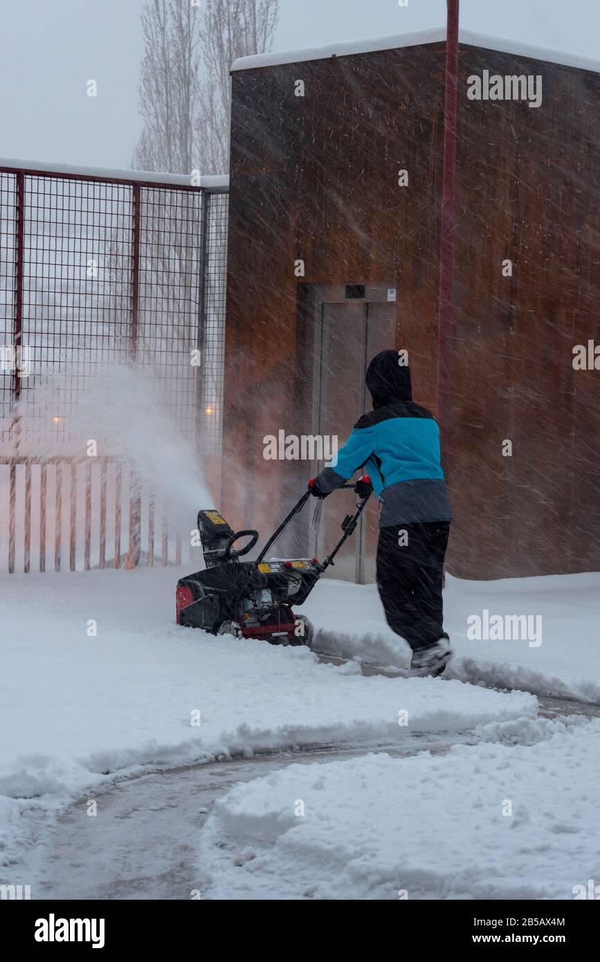 Man removes snow ice hi-res stock photography and images - Alamy