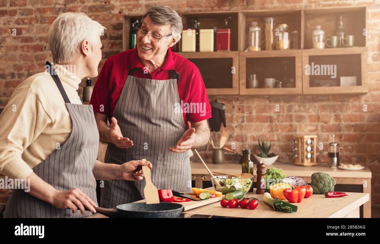 Retired couple enjoying meal at home hi-res stock photography and ...
