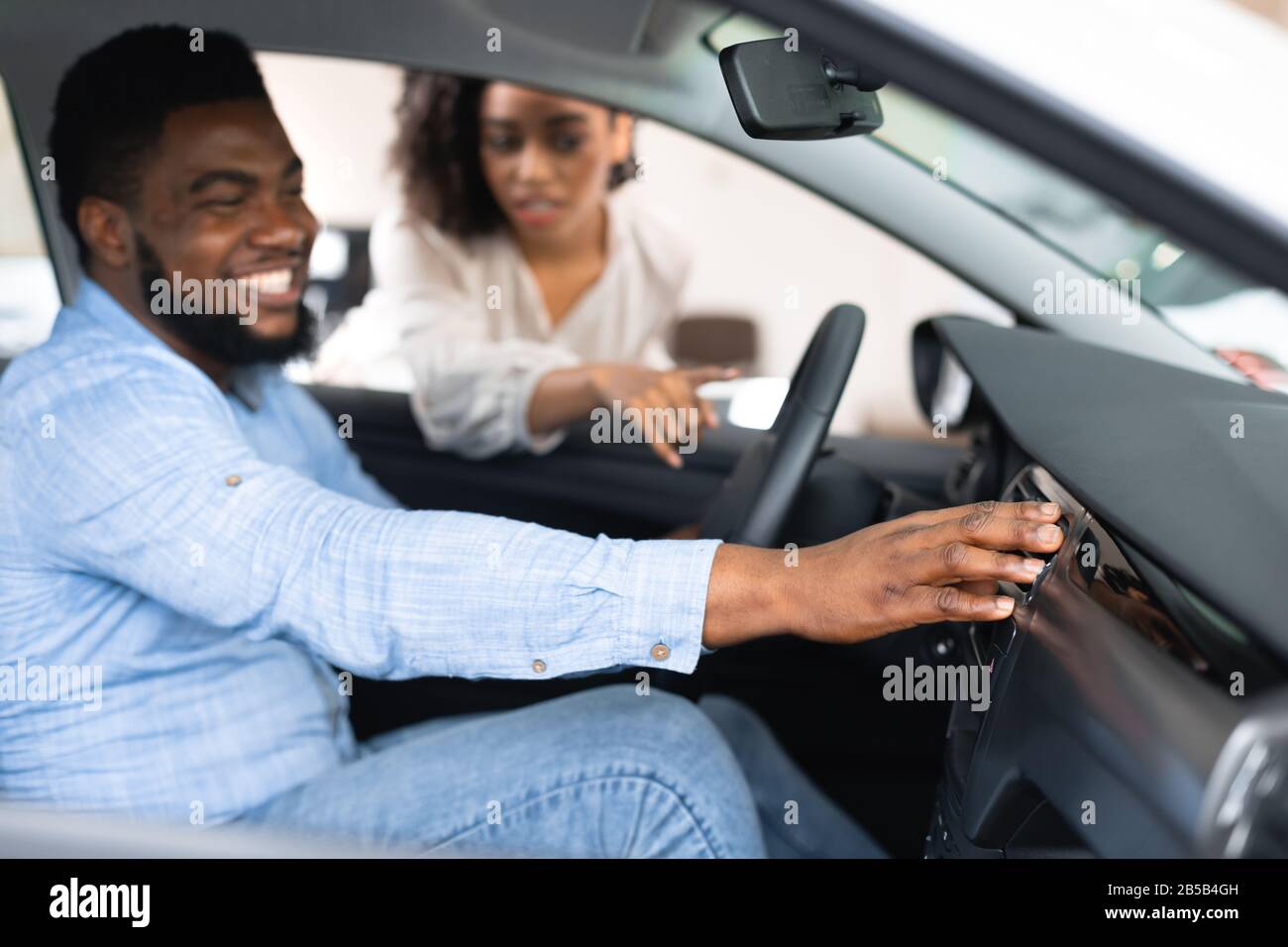 Family Couple Choosing New Car Testing Auto In Dealership Store Stock ...