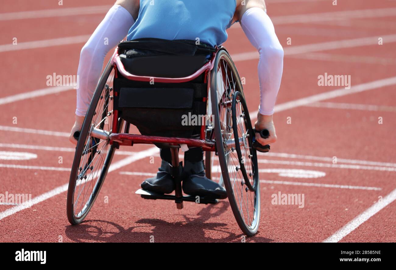 Paralympic athlete in a wheelchair with a paralysis in the legs while ...
