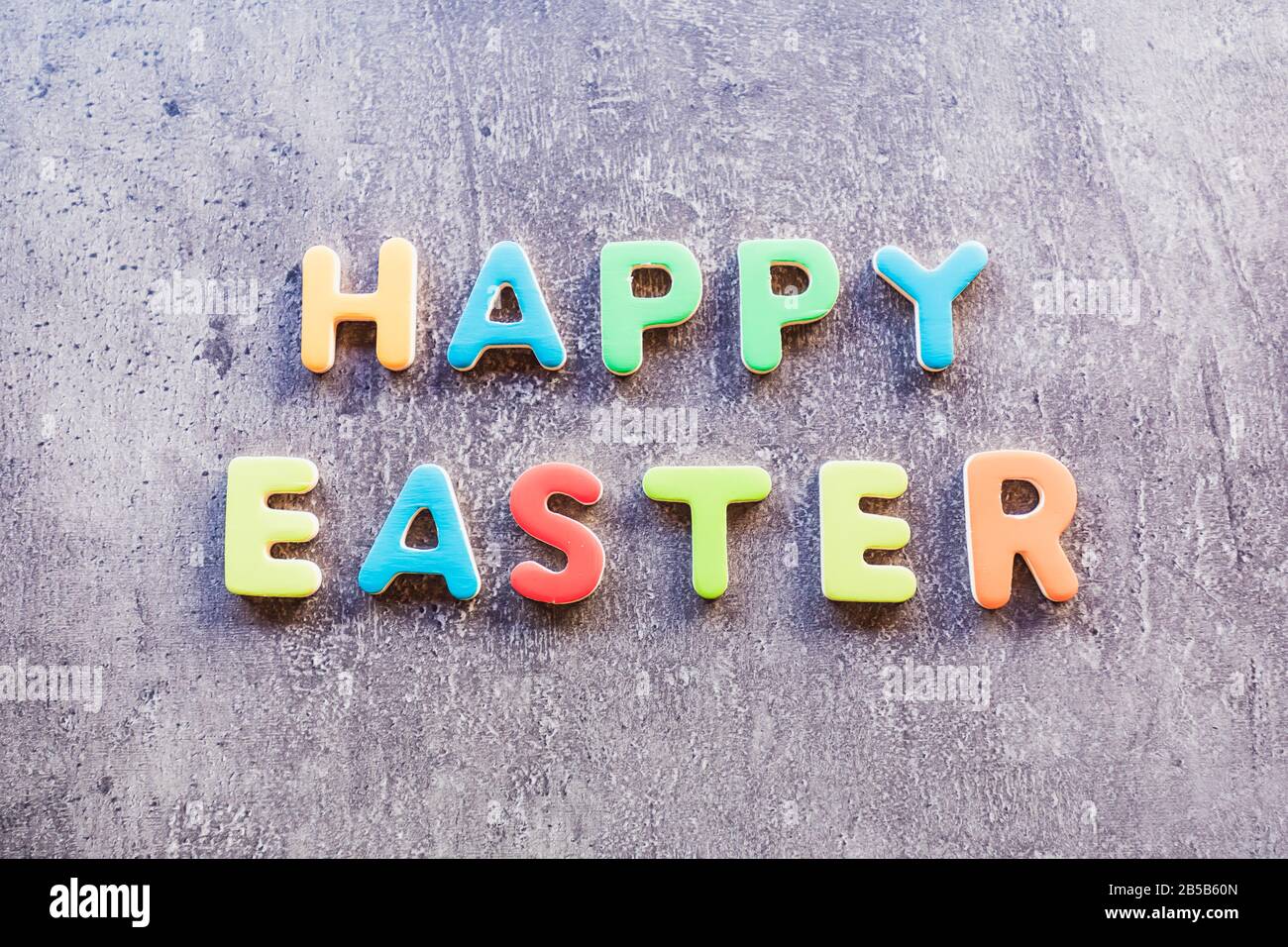 Colorful letters Happy Easter on granite background, word Stock Photo ...