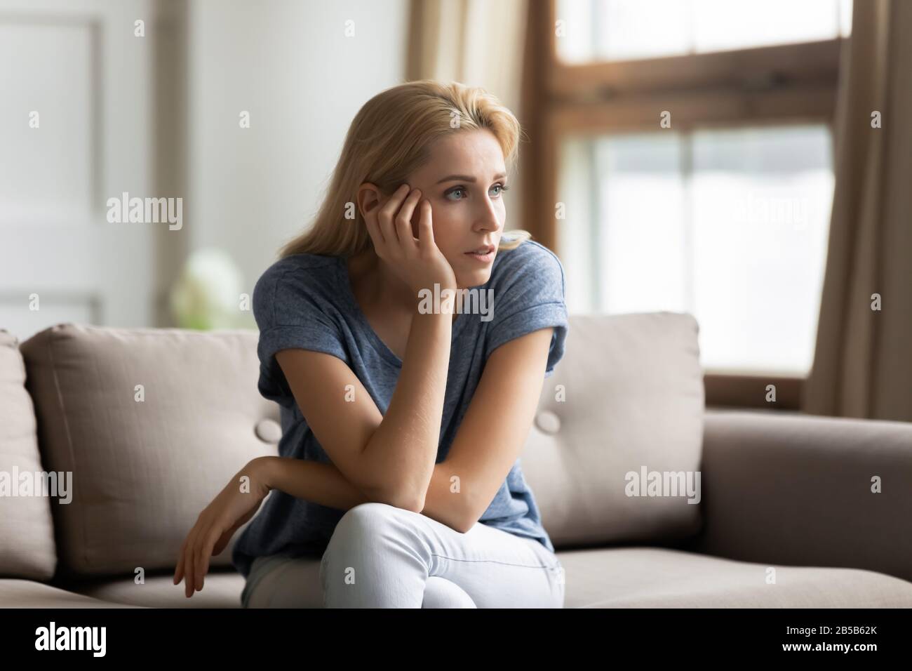 Woman pondering hi-res stock photography and images - Alamy