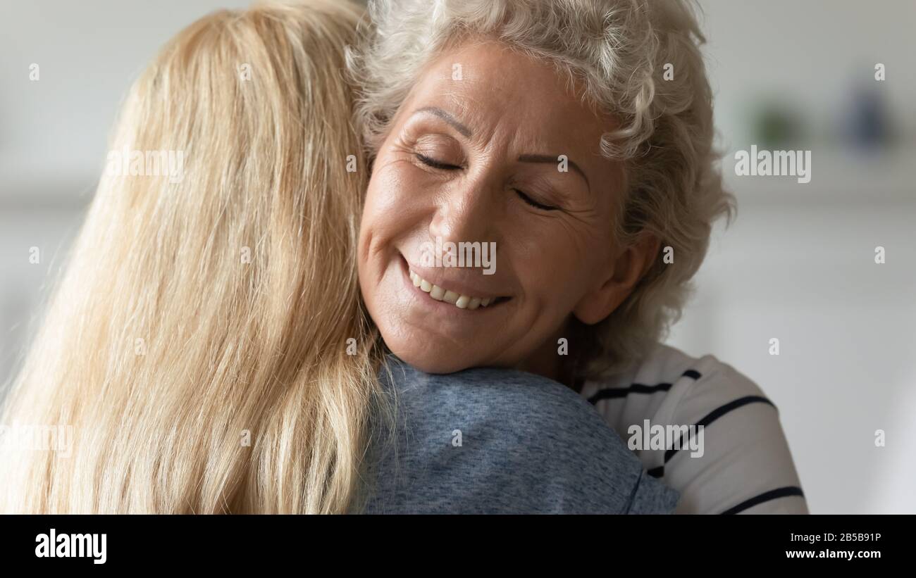 Happy mature mom hug embrace adult daughter Stock Photo - Alamy