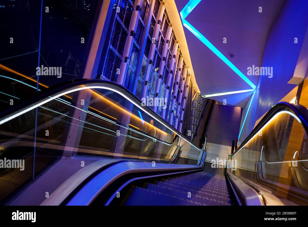escalator with LED light beside in technology abstract neon colorful ...