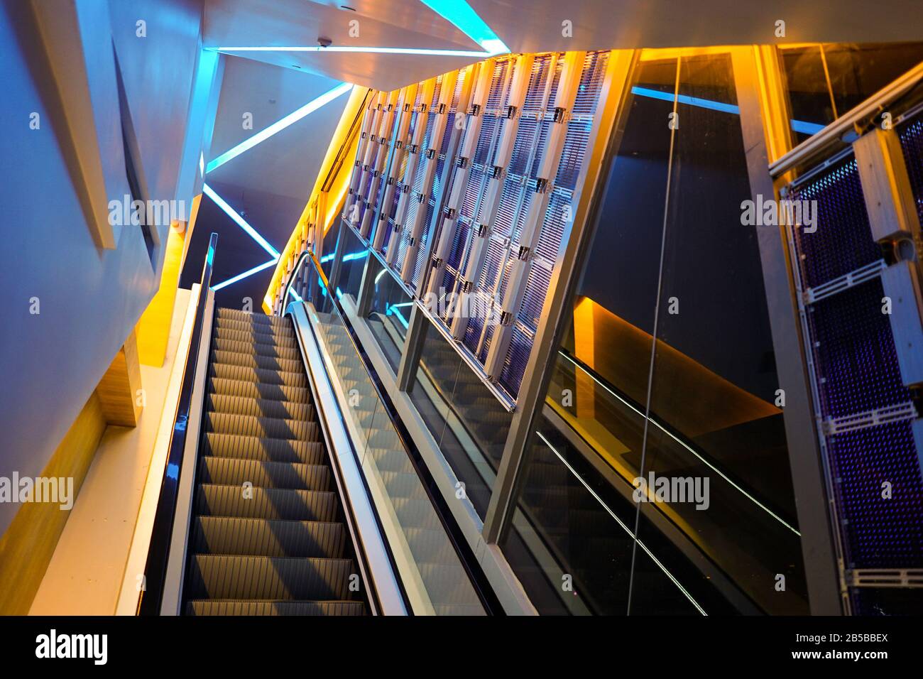 escalator with LED light beside in technology abstract neon colorful ...