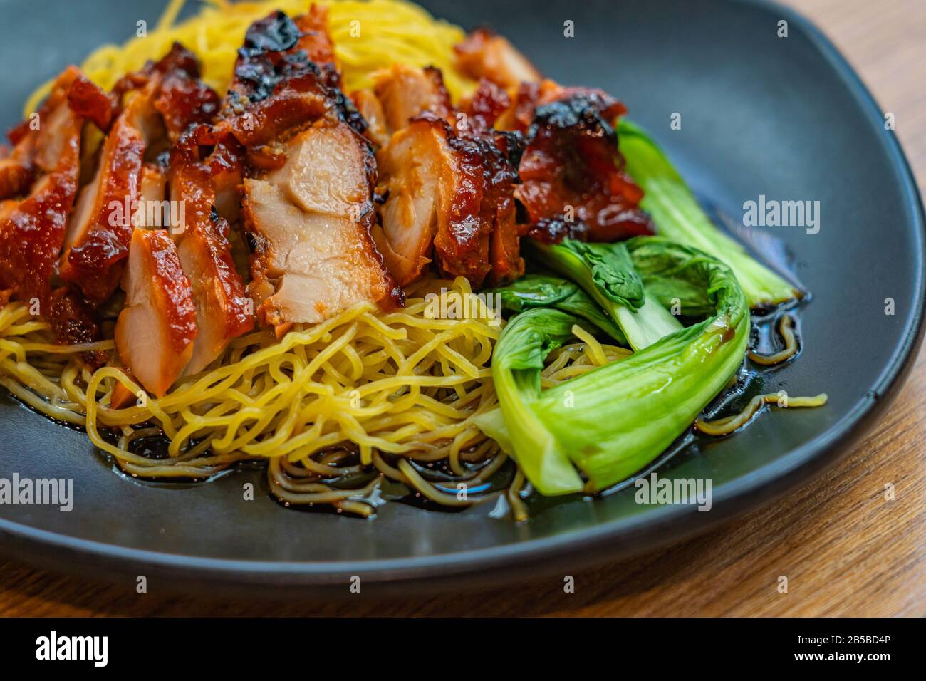 Plate of char siew noodle served in Chinese restaurant Stock Photo - Alamy