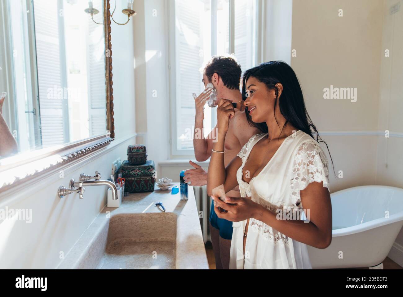 Couple in love spending time together in the house. Romantic moments in the bathroom Stock Photo ...