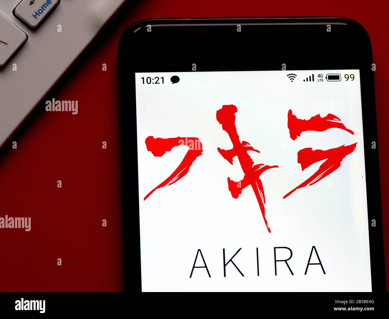 In this photo illustration the Akira logo is seen displayed on a smartphone Stock Photo - Alamy