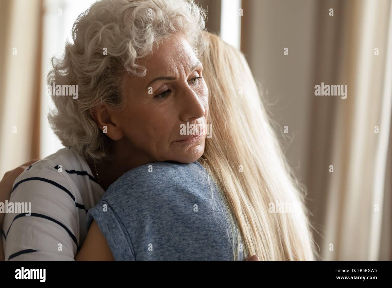 Mother daughter hug sad hi-res stock photography and images - Alamy