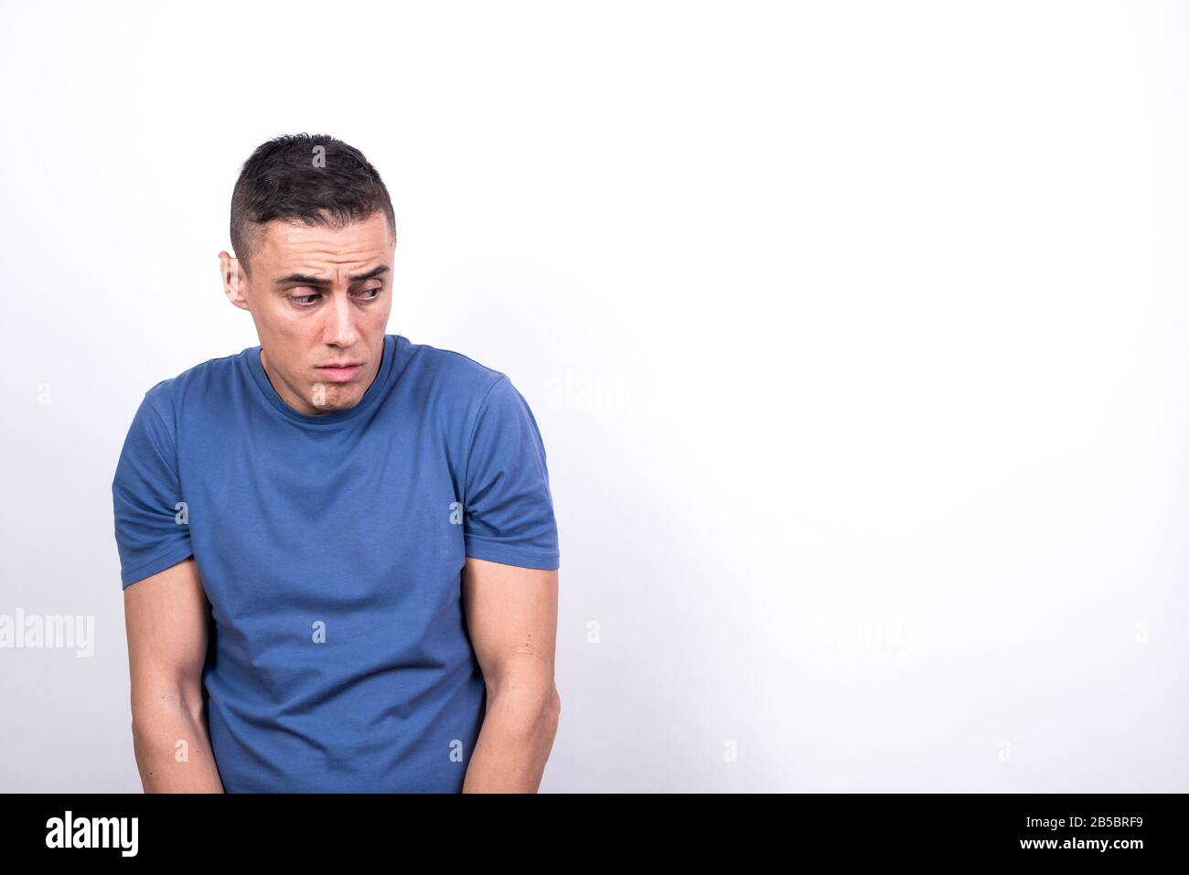 Scared man on white background, medium shot Stock Photo - Alamy