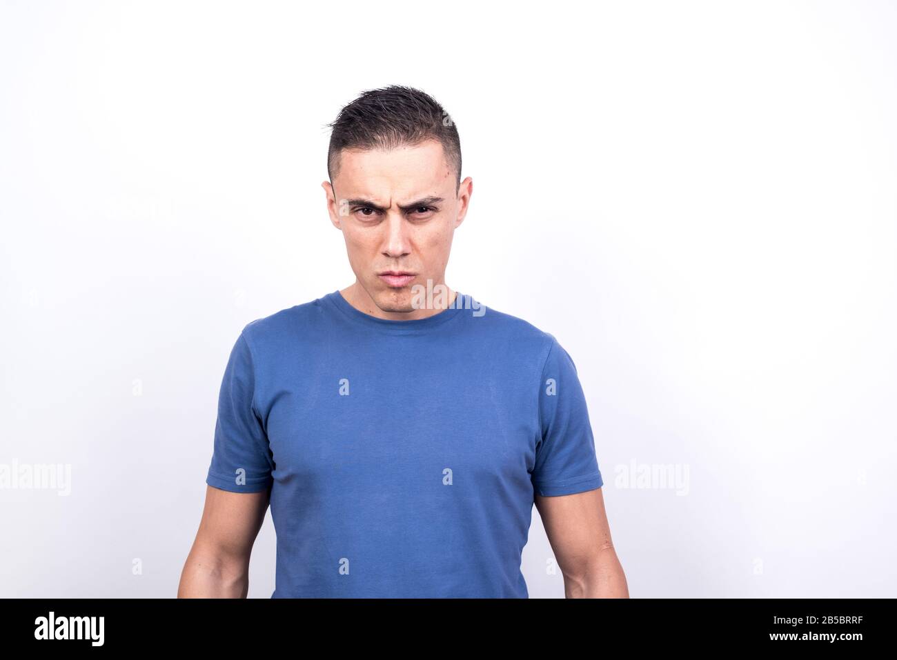 Challenging man. White background. Middle plane Stock Photo - Alamy