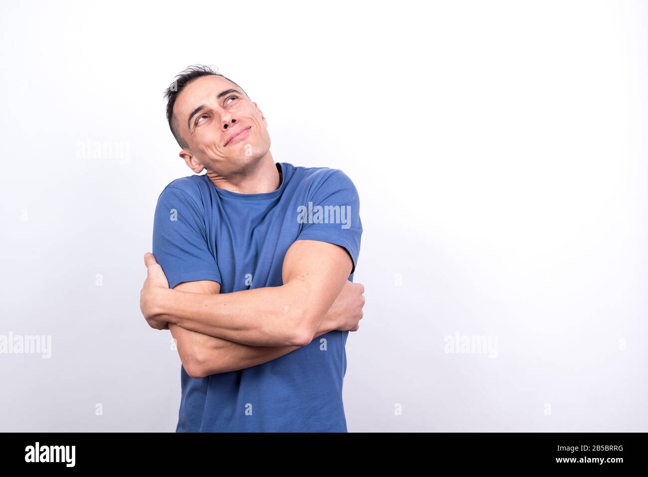 Man hugging himself hi-res stock photography and images - Alamy