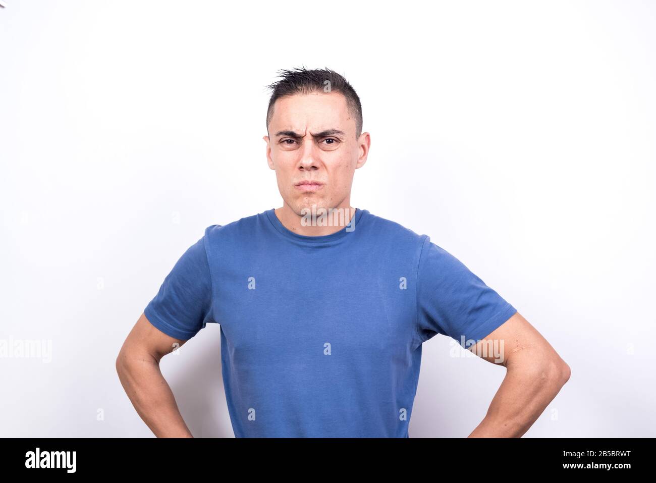 Distrustful man White background. Middle plane Stock Photo - Alamy