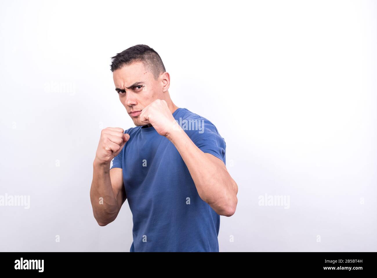 Angry man. white background, medium shot Stock Photo - Alamy