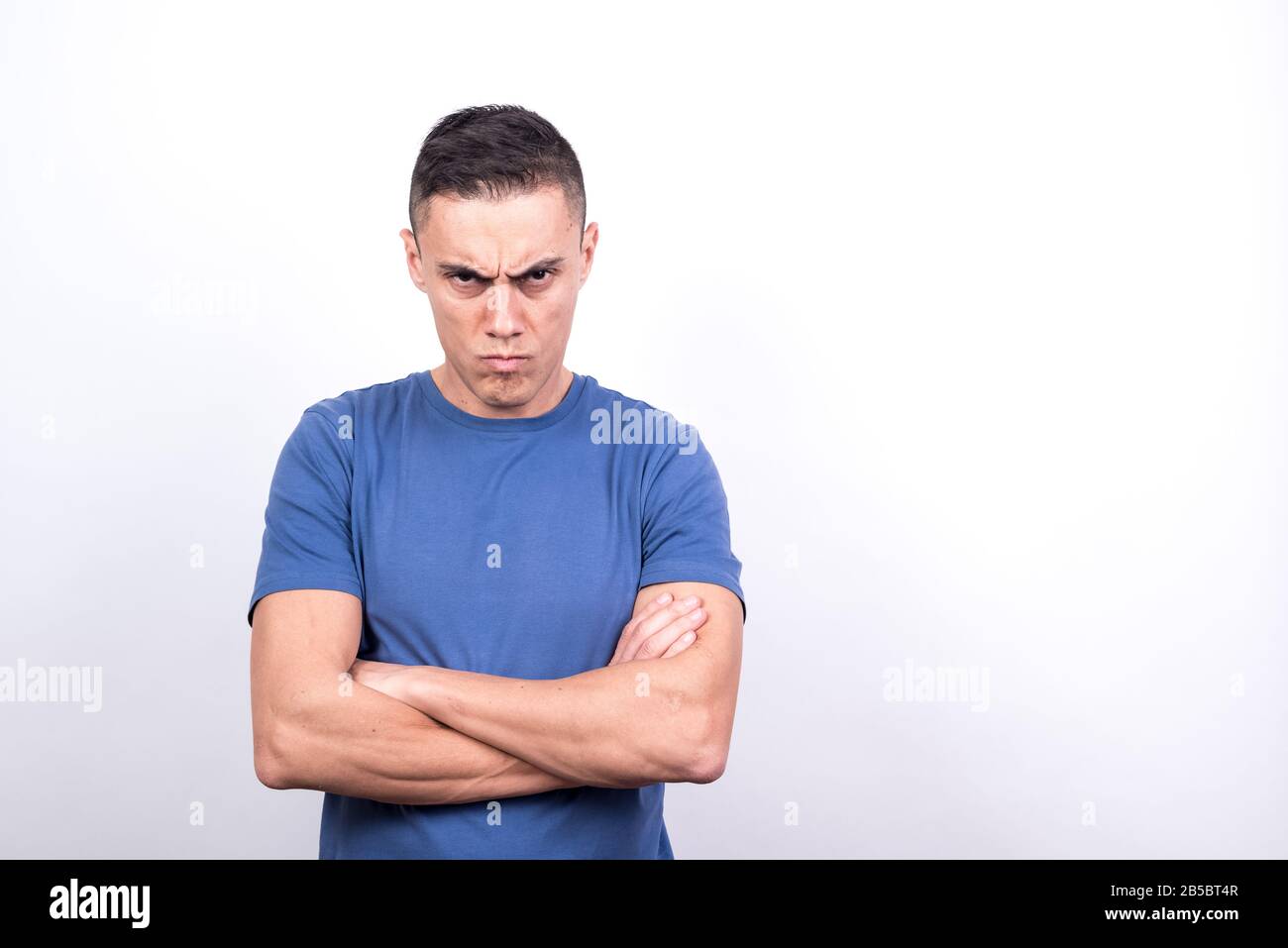 Angry man. white background, medium shot Stock Photo - Alamy
