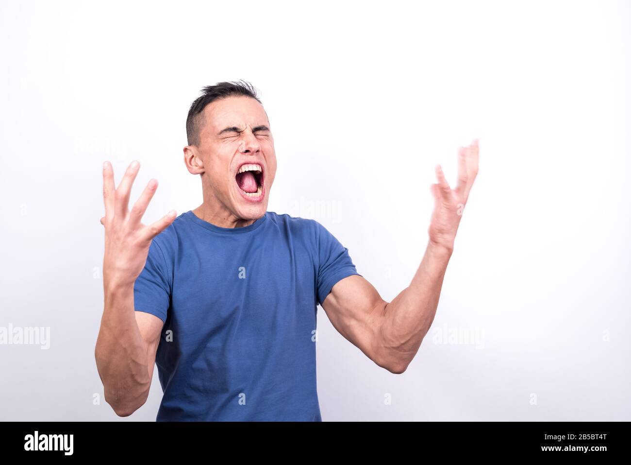 hysterical man White background, medium shot Stock Photo - Alamy
