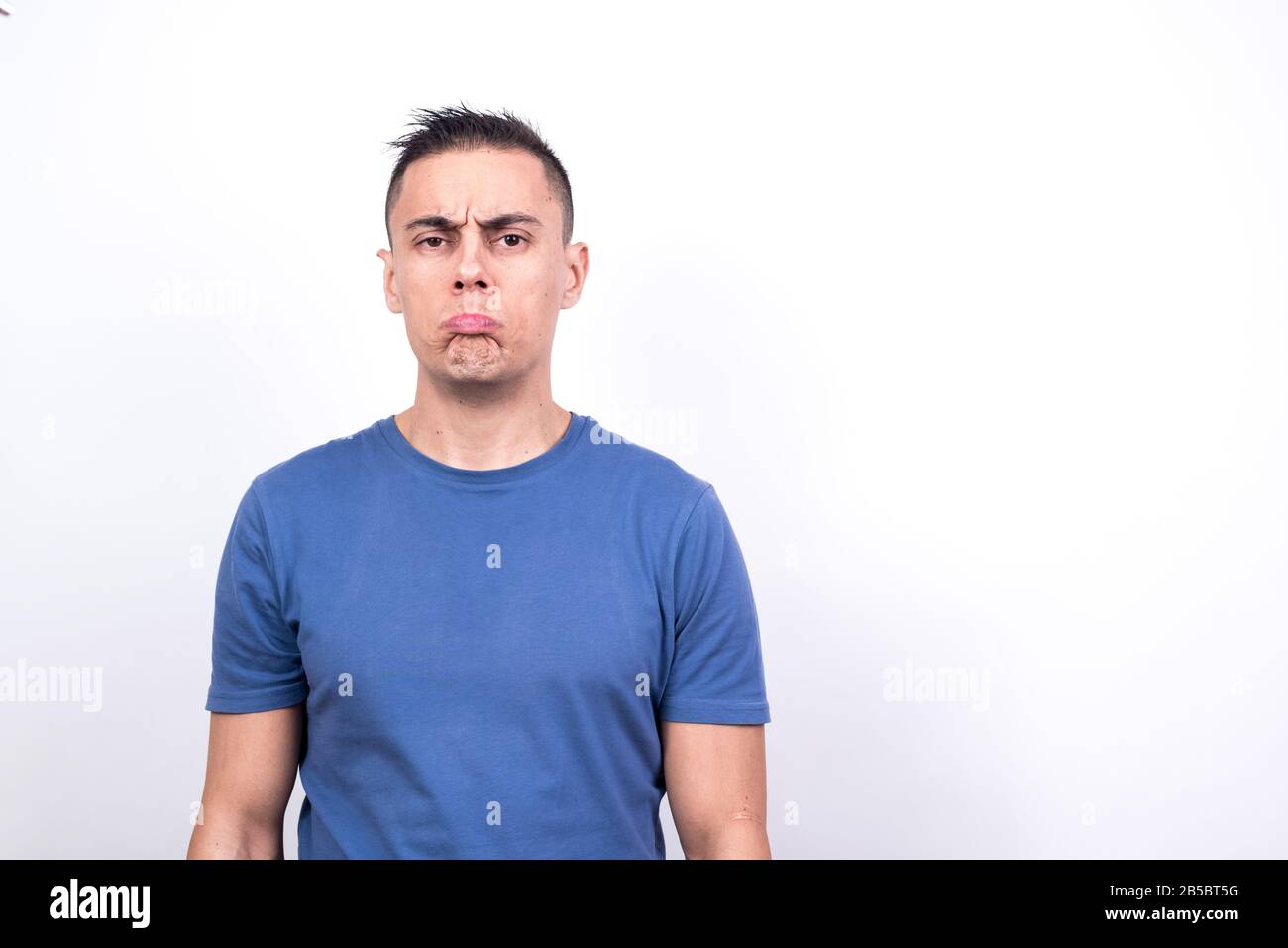 Angry man. white background, medium shot Stock Photo - Alamy