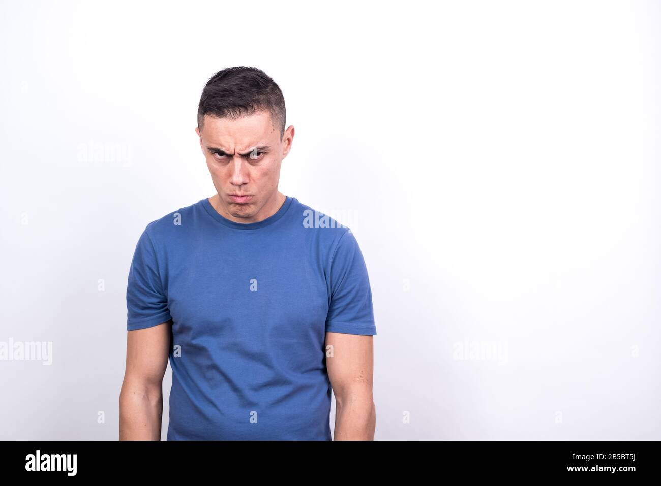 Angry man. white background, medium shot Stock Photo - Alamy