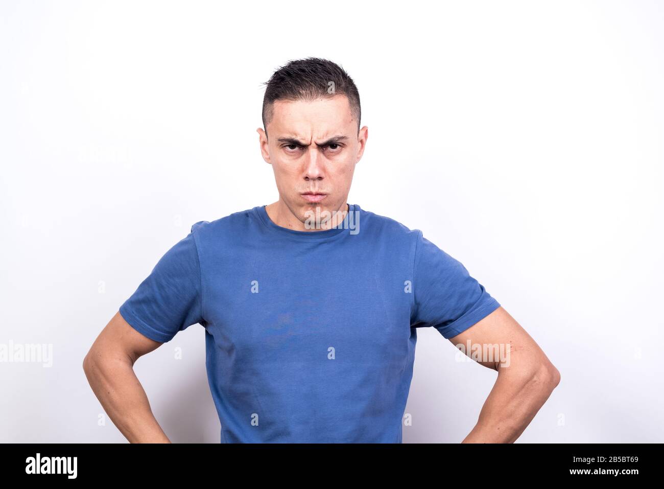 Angry man. white background, medium shot Stock Photo - Alamy