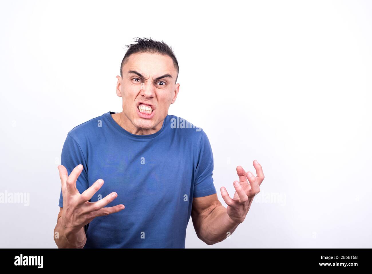 Angry man. white background, medium shot Stock Photo - Alamy