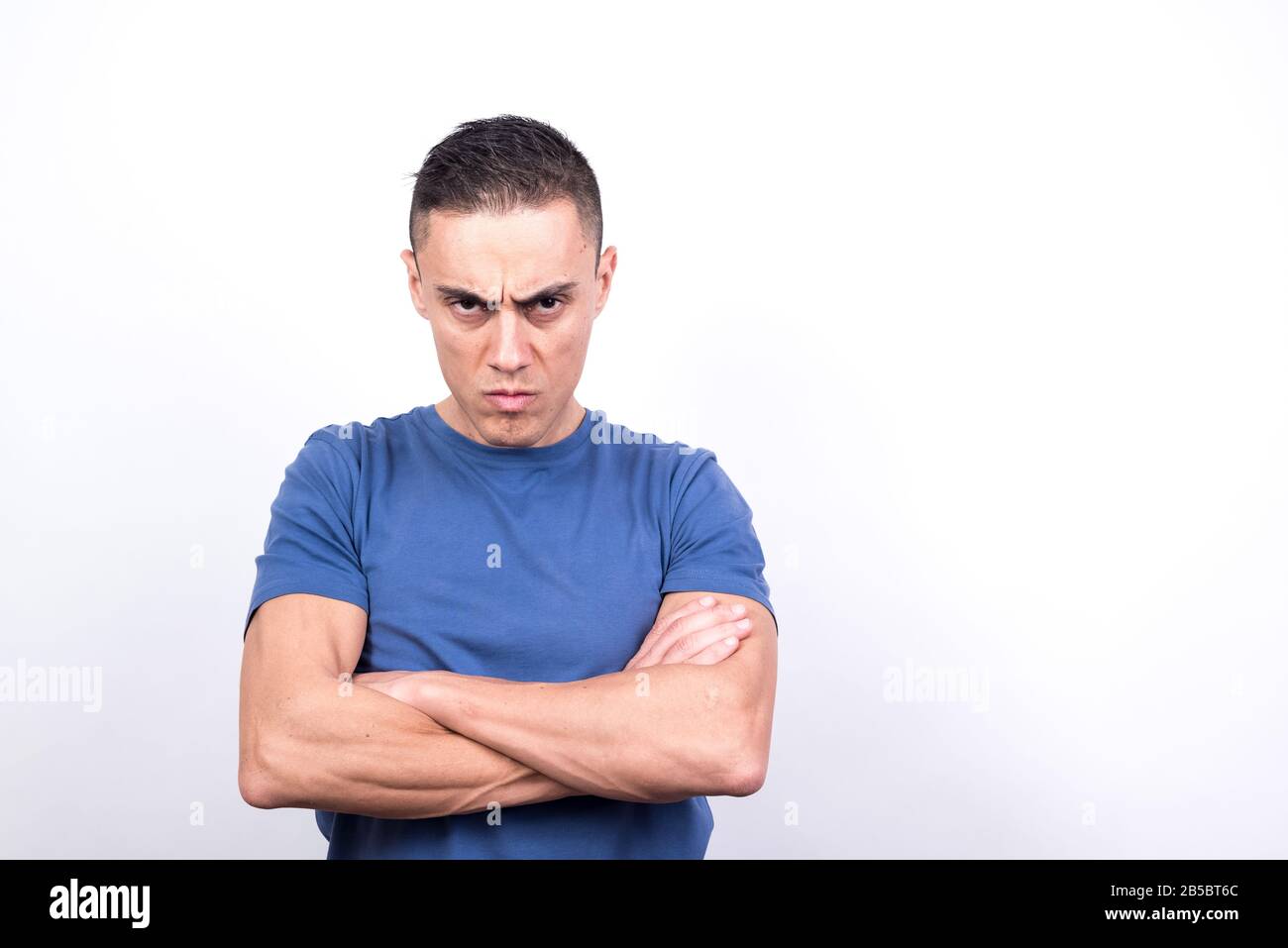 Angry man. white background, medium shot Stock Photo - Alamy
