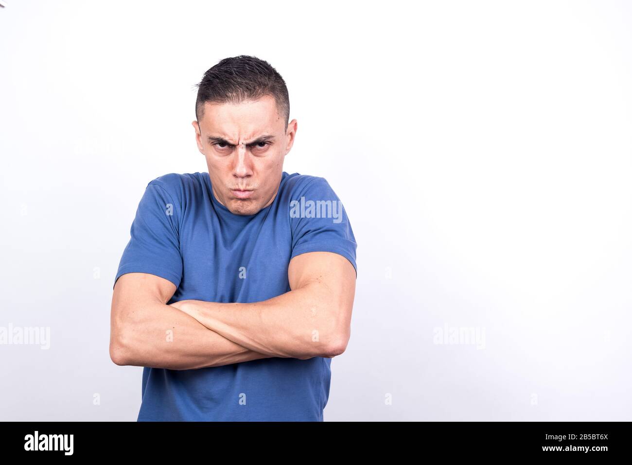 Angry man. white background, medium shot Stock Photo - Alamy