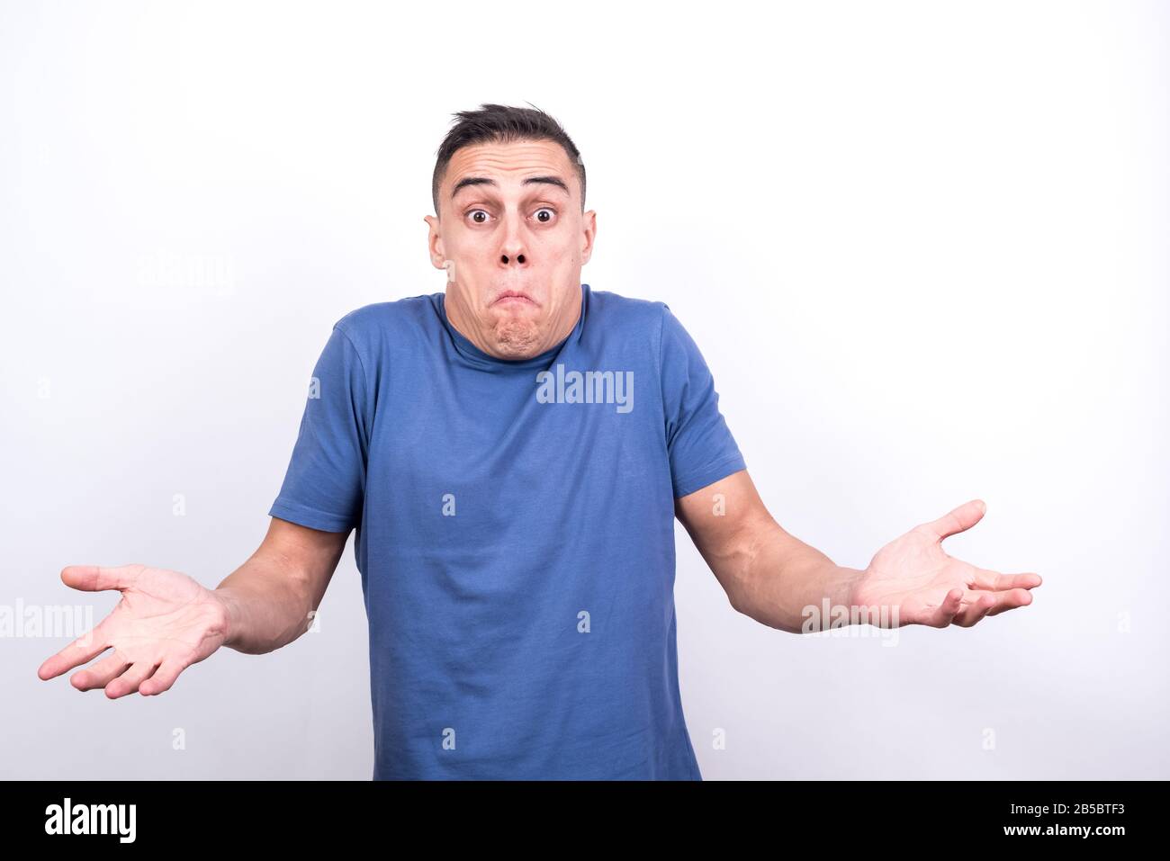 Doubting man. White background, Medium shot Stock Photo - Alamy