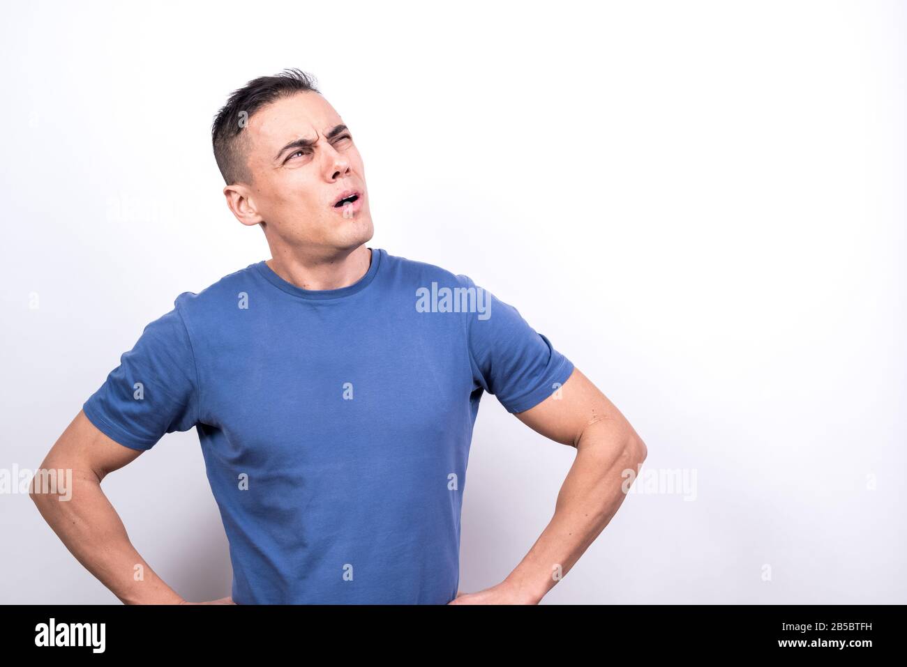 Doubting man. White background, Medium shot Stock Photo - Alamy