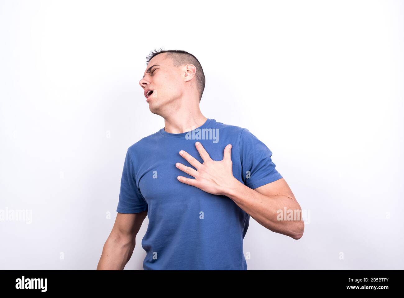 Angry man. white background, medium shot Stock Photo - Alamy