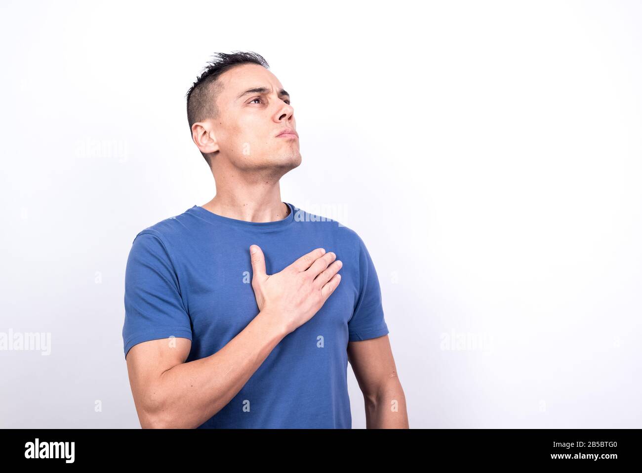 Honest man with hand in heart, white background, medium shot Stock ...