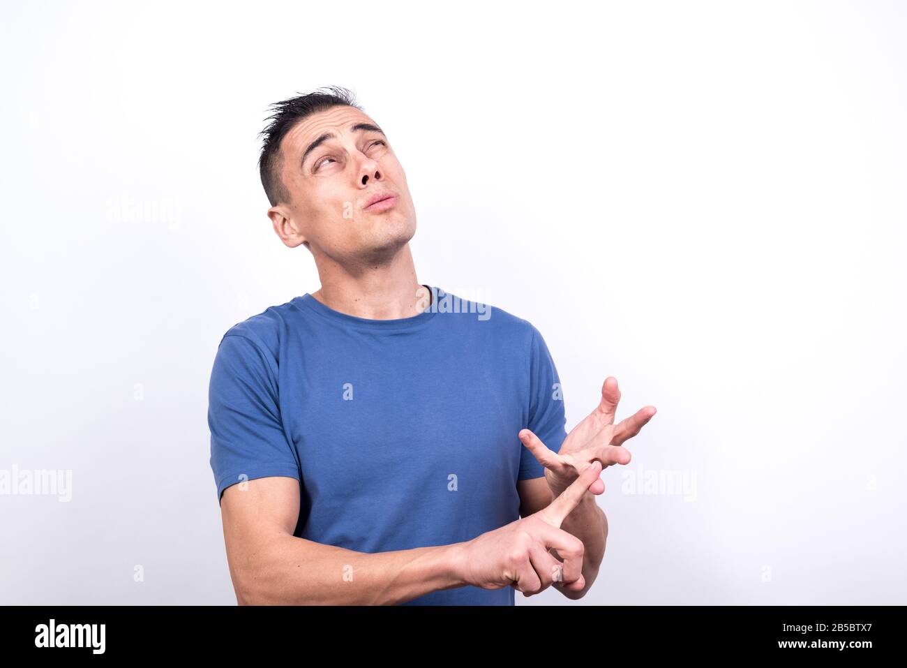 Man counting on fingers. White background, Medium shot Stock Photo - Alamy