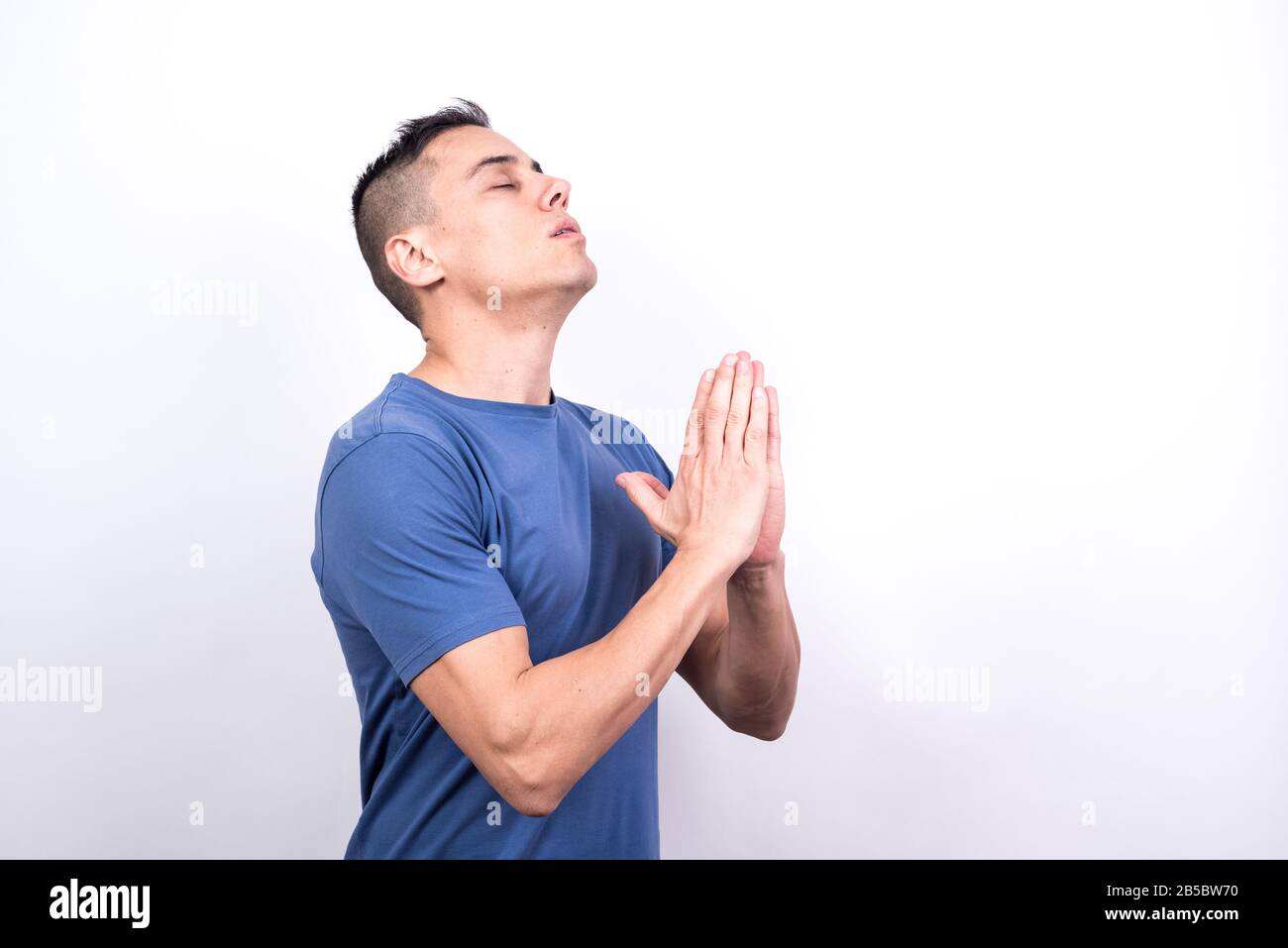Man praying. White background, Medium shot Stock Photo - Alamy