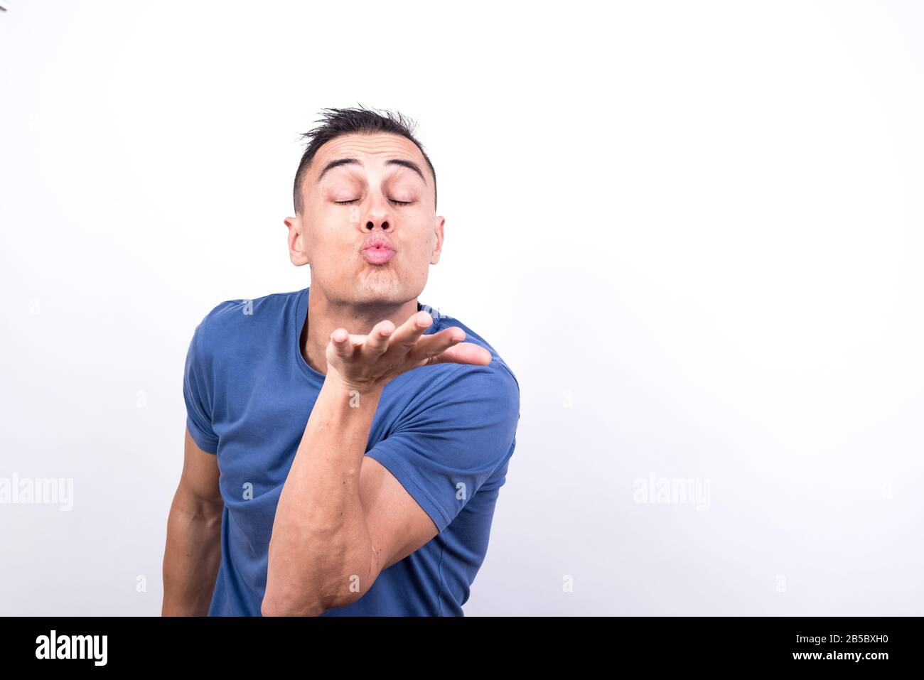 Man throwing a kiss. White background, Medium shot Stock Photo - Alamy