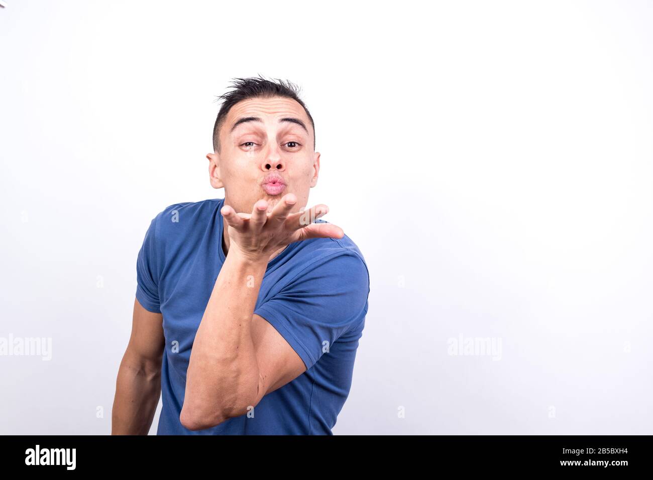 Man throwing a kiss. White background, Medium shot Stock Photo - Alamy