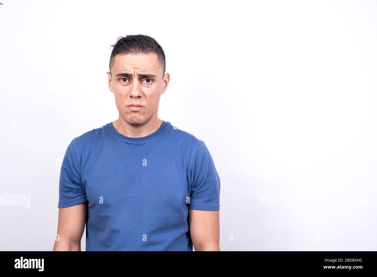 Sad man. White background, Medium shot Stock Photo - Alamy