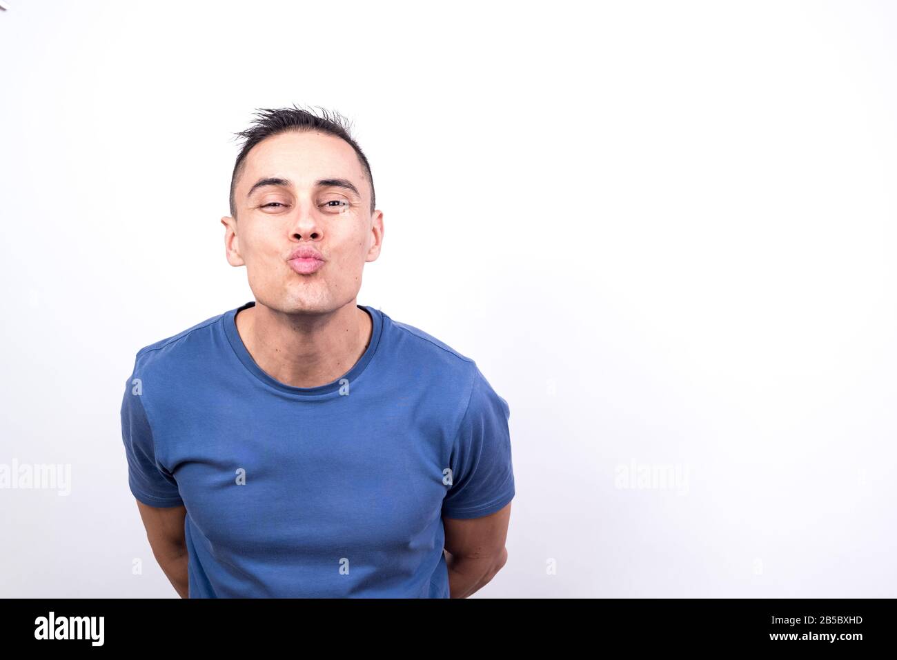 Man throwing a kiss. White background, Medium shot Stock Photo - Alamy