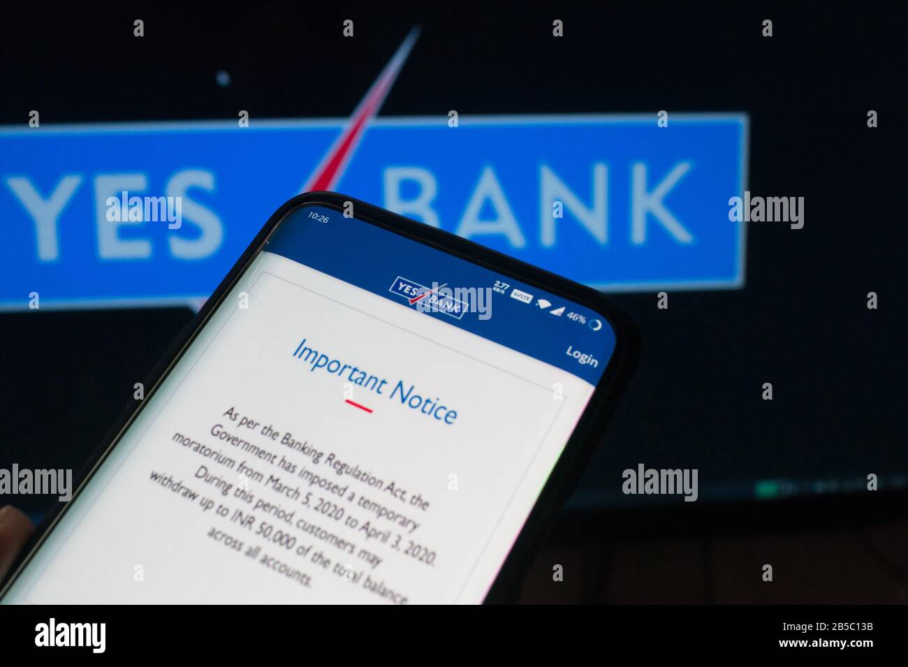 A mobile logged into the yes bank mobile application infront of the yes ...