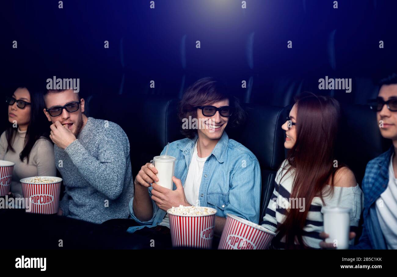 Things to do on weekend. Millennial friends in 3D glasses enjoying ...