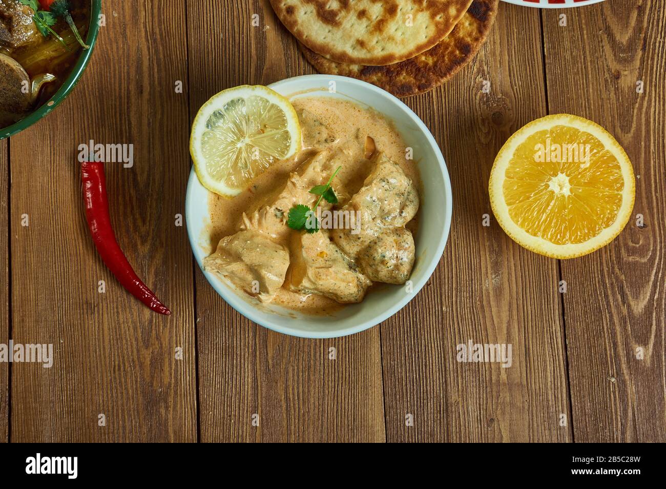 Nawabi Chicken,Chicken is cooked in an onion, cashewnut and curd gravy ...